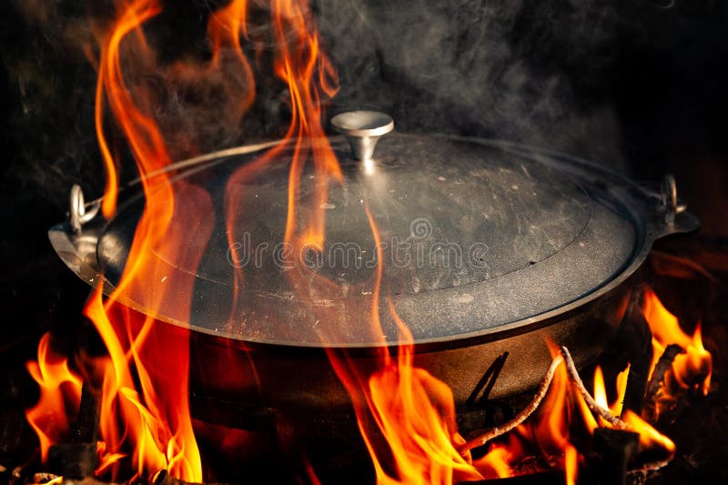 Outdoor Cooking with an Cast Iron Pot on a Open Fire Stock Photo ...