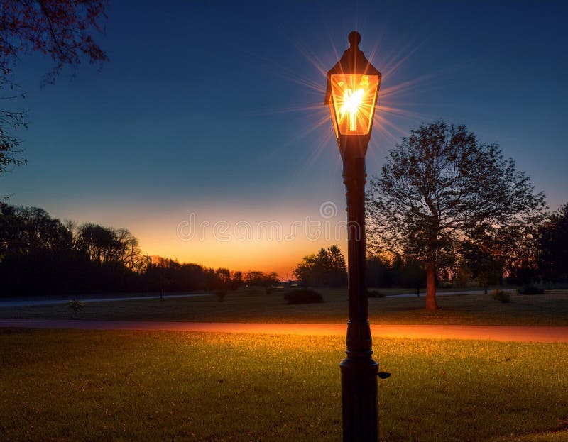 An Outdoor Electric Lamp Post at Twilight with Soft Glowing Light in a ...
