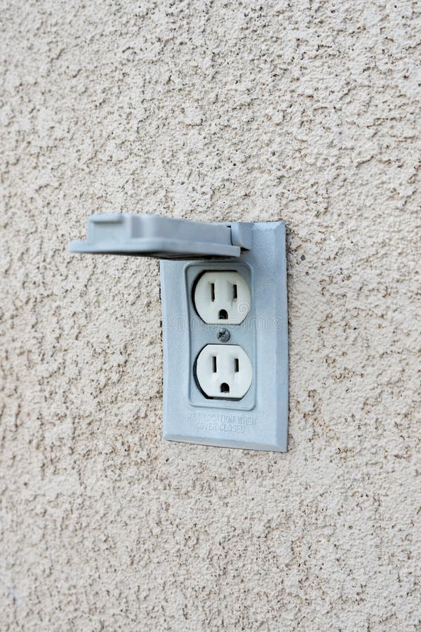 Outdoor Electrical Outlet with Cover in Beige Stucco Wall. Stock Photo ...