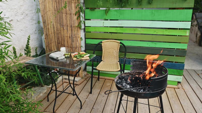 Outdoor Fish Barbecue Setup with Grilled Fish and Drinks on a Rustic ...