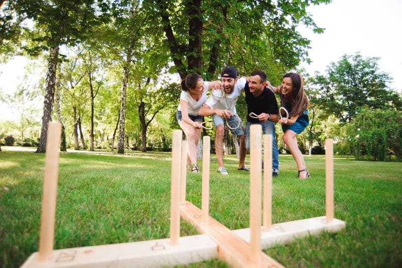 Outdoor Games - Ring Toss, Friends Playing Ring Toss In A Park. Stock ...