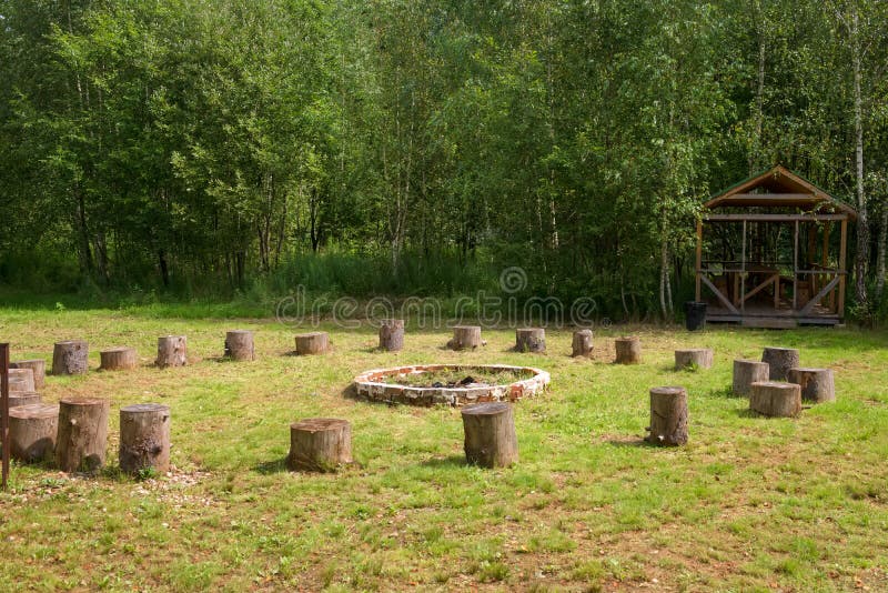 Outdoor Meeting Place with Hearth and Seating Stumps Stock Image ...