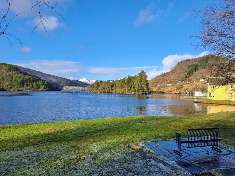 Outdoor Park Bench Situated beside a Tranquil Expanse of Water, with a ...