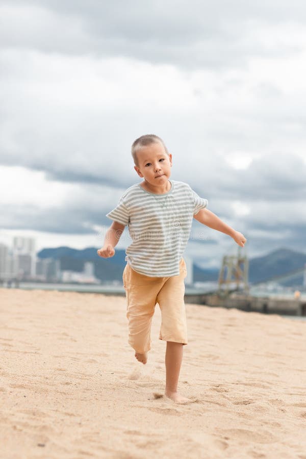 Outdoor Portrait of a Little Boy Running Stock Photo - Image of ...