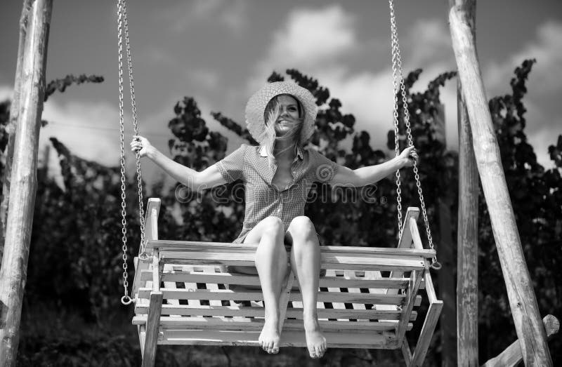 Outdoor Portrait Of A Smiling Happy Girl Young Woman Swinging On A