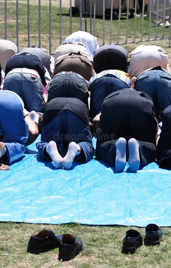 Outdoor Prayers stock photo. Image of backs, fence, shirts - 3030764