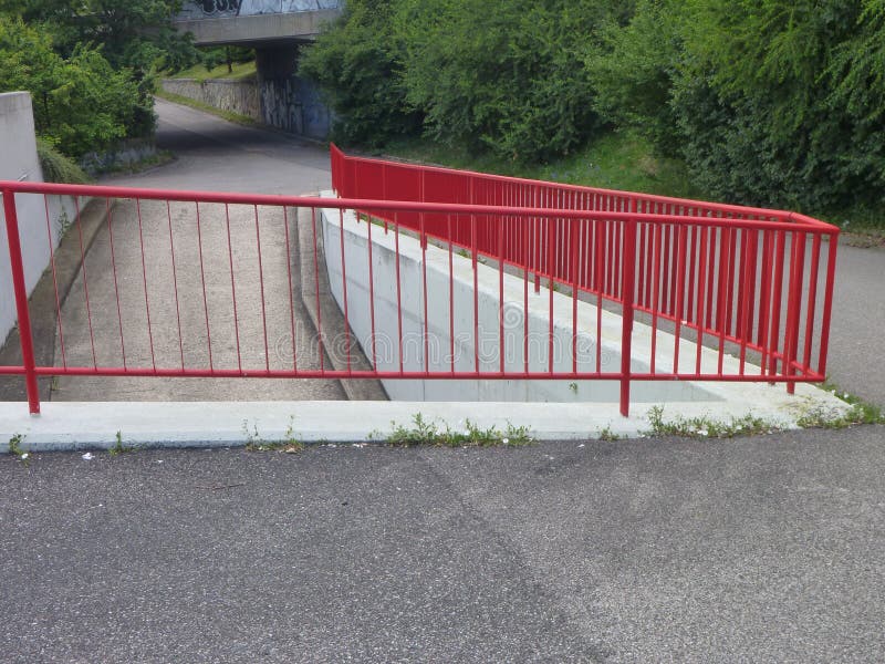 Outdoor Ramp and Staircase with Red Railing Stock Photo - Image of ...