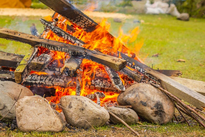 Stone-lined Campfire at a Picnic Stock Photo - Image of stick, flame ...