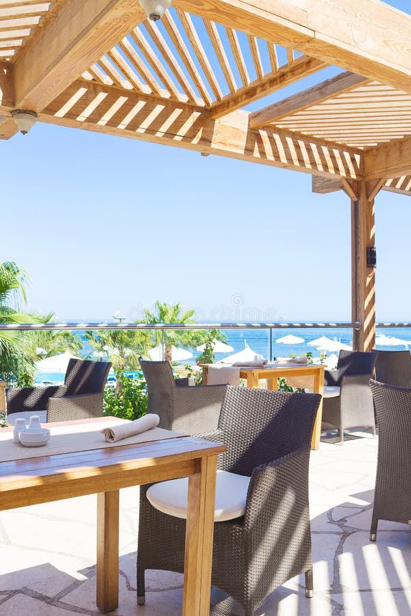 Outdoor Restaurant Overlooking the Sea and Palm Trees Stock Photo ...