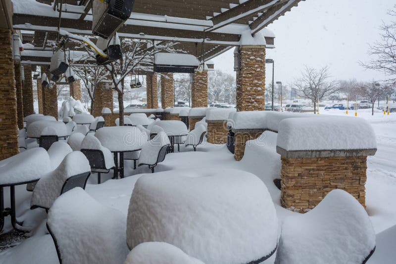 Outdoor Restaurant Patio on a Cold, Snowy Day Stock Image - Image of ...