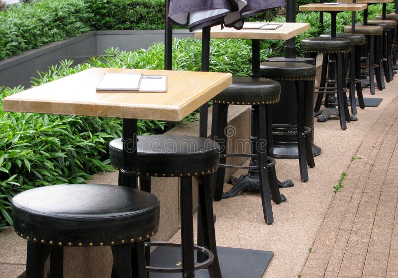 Outdoor Restaurant Tables and Leather High Stools Stock Photo - Image ...