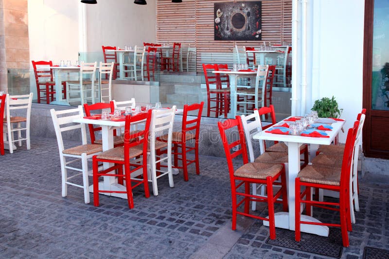 Outdoor Restaurant with White Table and Red Chairs, Crete, Greece ...