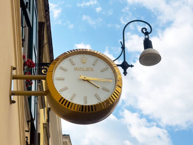 Outdoor Rolex Clock on Building Facade Against Blue Sky Editorial Stock ...