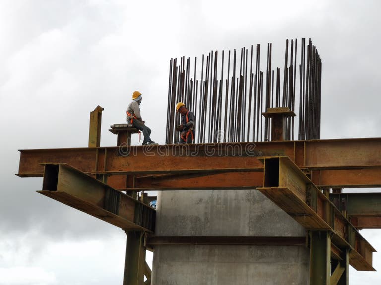Outdoor Scenery at Construction Site with Metal Beams and Workers ...