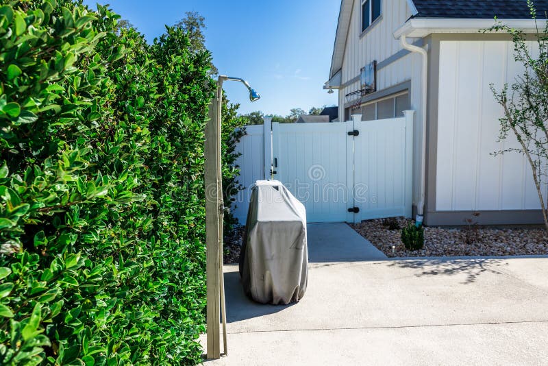 An Outdoor Shower Near a Backyard Fenced Swimming Pool Stock Image ... An Outdoor Shower Near a Backyard Fenced Swimming Pool Stock Image ...