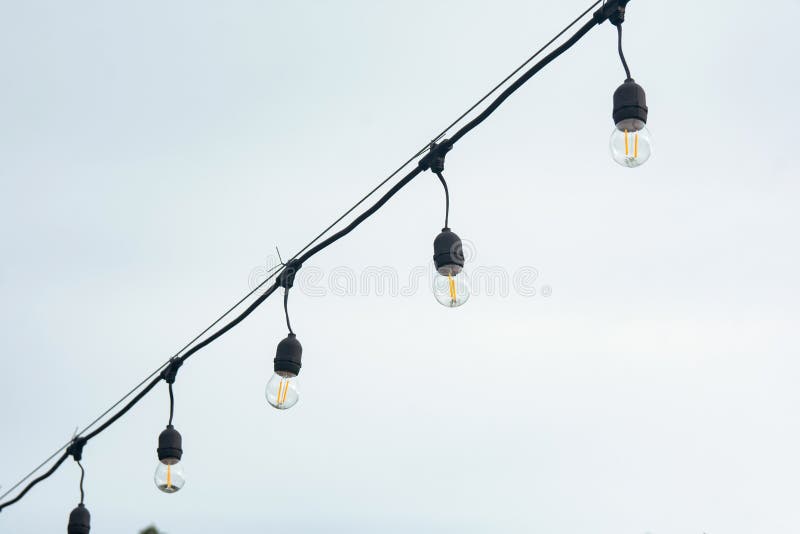 Outdoor String Light Bulbs Hanging on a Line Stock Photo - Image of ...