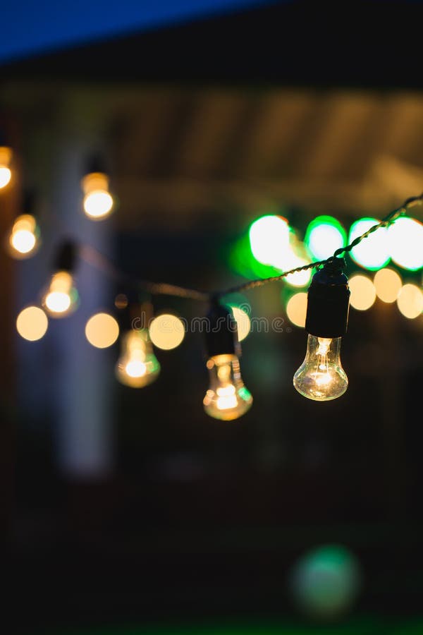 Outdoor String Lights Hanging on a Line in Backyard. Stock Image ...