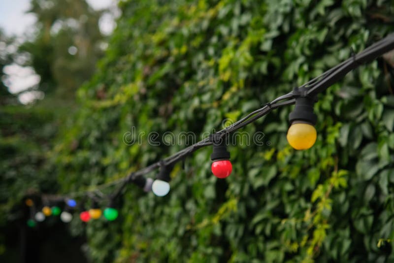 Outdoor String Lights Hanging on a Line in Small Town Stock Photo ...