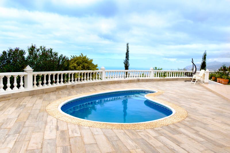 Outdoor swimming pool stock image. Image of residence - 81969645