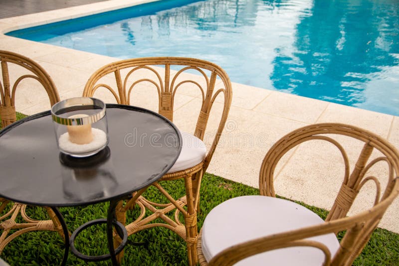 Outdoor Table and Chairs Over Pool Stock Image - Image of river ...