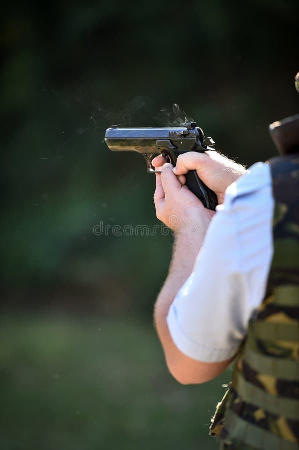 Outdoor Shooting with a 9mm Pistol in a Shooting Range Stock Image ...