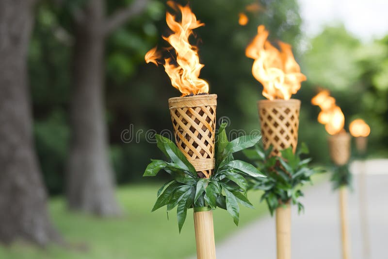 Outdoor Tiki Torches with Flames in a Green Park Setting Stock Image ...