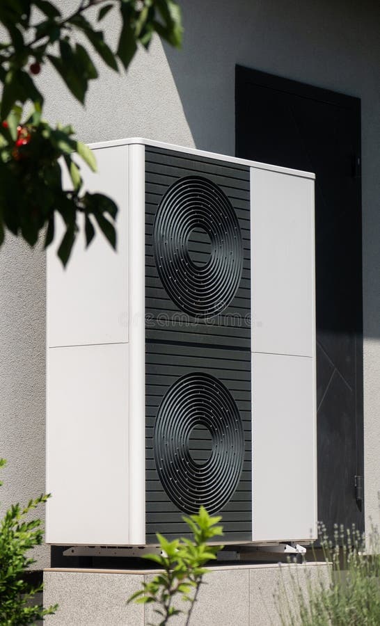 Outdoor Unit of a Heat Pump by the Wall of a House. Modern and Energy ...