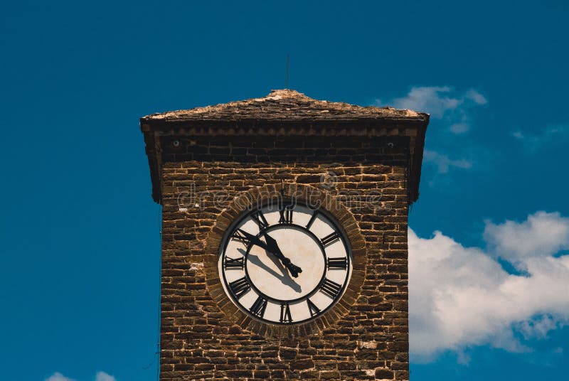 Outdoor View of a Clocktower Against Blue Sky Stock Image - Image of ...