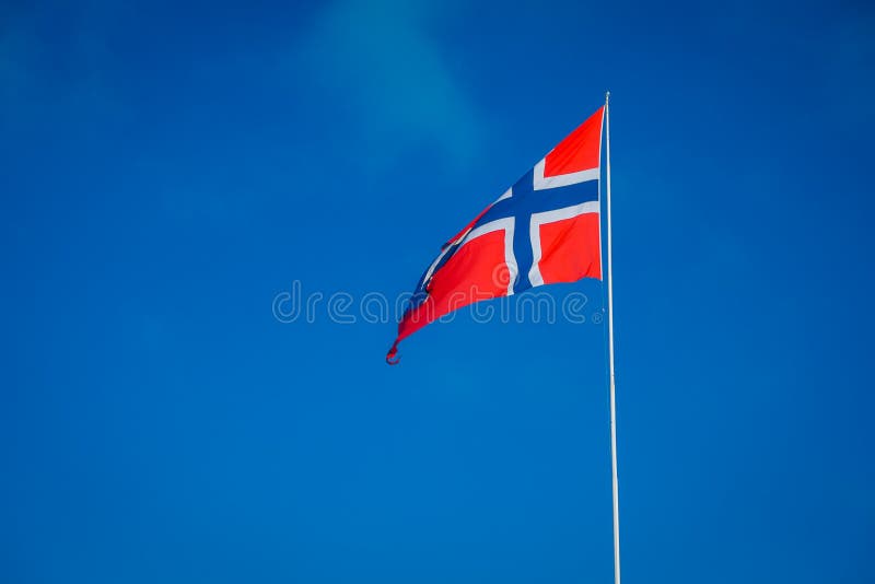 Outdoor View of Norwegian Flag with a Beautiful Blue Sky Stock Photo ...
