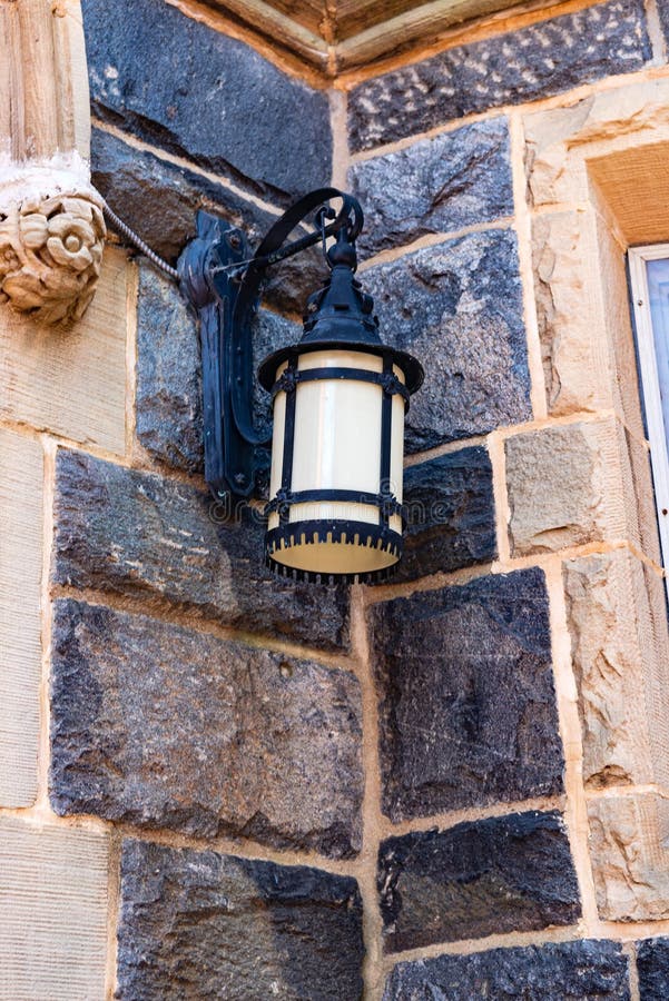 Outdoor Wall Mounted Gas Lantern on Stone Wall. Vintage Iron Lantern on ...