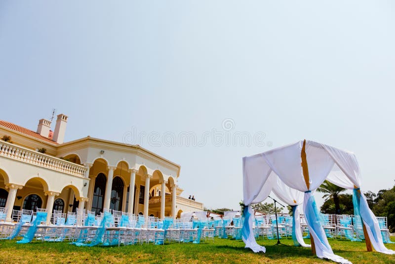 Outdoor Wedding Venue in White and Blue in Front of a Building Stock ...