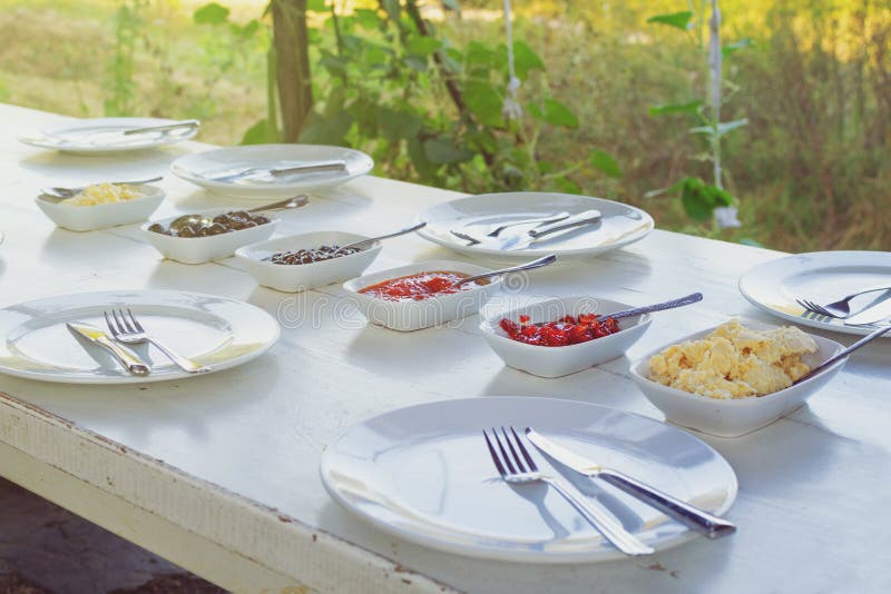 Outdoor White Vintage Table Set for Breakfast with Empty Plates Ready ...