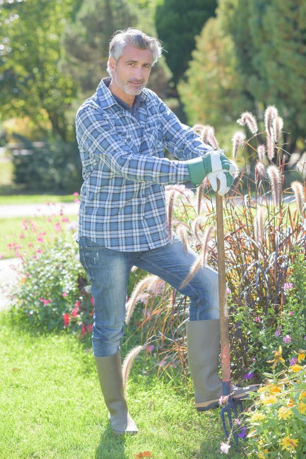 Outdoor Worker Holding Rake Stock Photo - Image of retire, outdoor ...