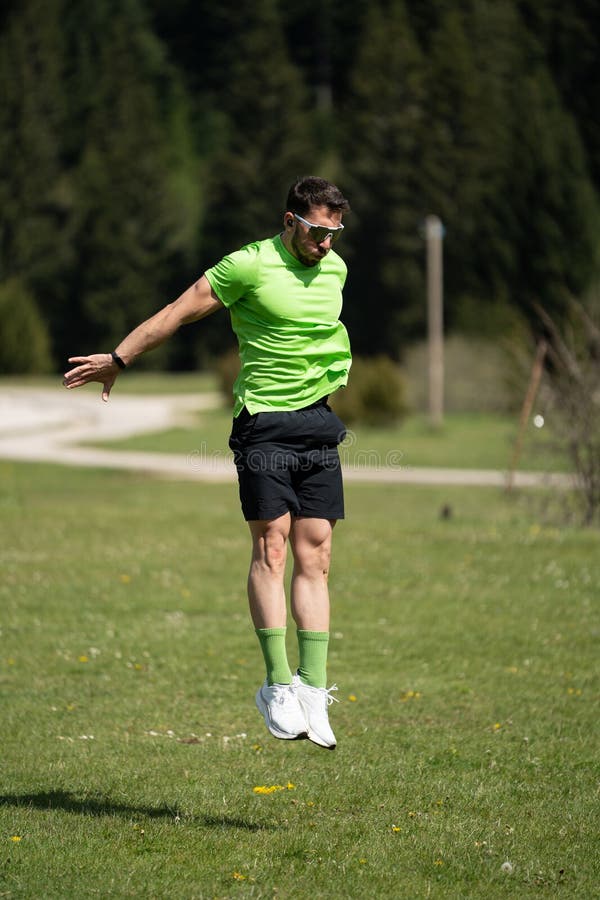 Outdoor Workout with Man Jumping To His Max Stock Image - Image of ...