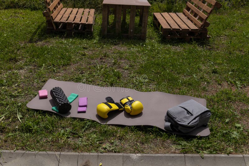 Outdoor Workout Setup with Exercise Mat Foam Roller Boxing Gloves and ...