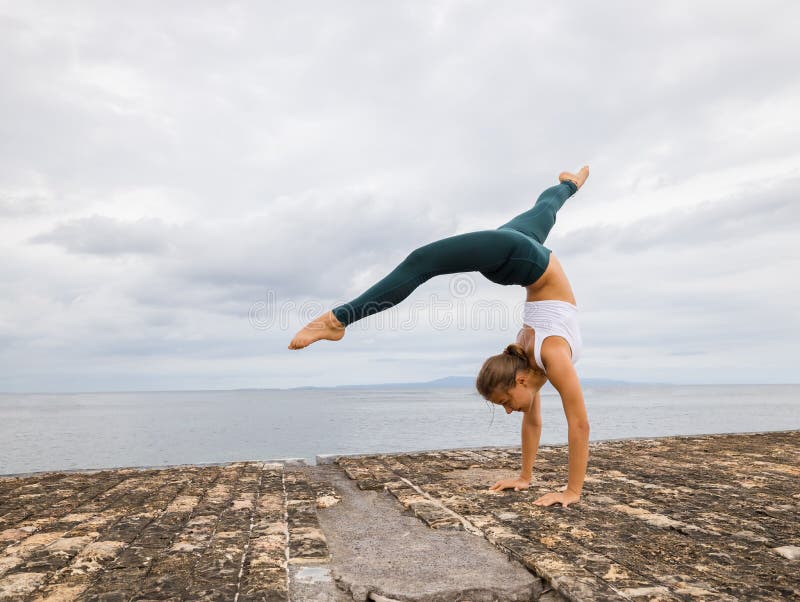 Outdoor Yoga Practice Near The Ocean Caucasian Woman Practicing Adho