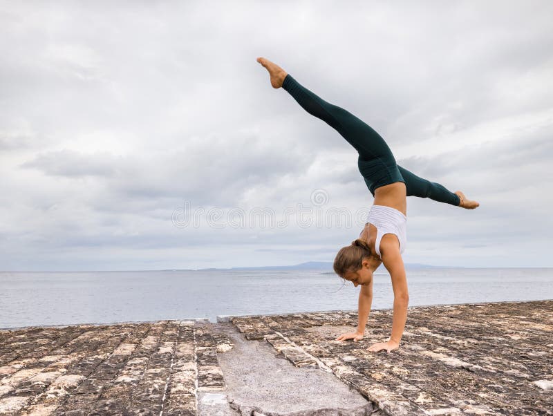 Outdoor Yoga Practice Near The Ocean Young Woman Practicing Adho Mukha