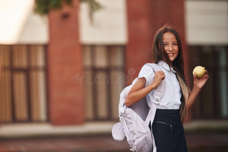 Outdoors Near the Building. School Girl in Uniform Stock Image - Image ...