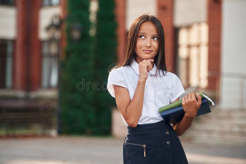 Outdoors Near the Building. School Girl in Uniform Stock Image - Image ...