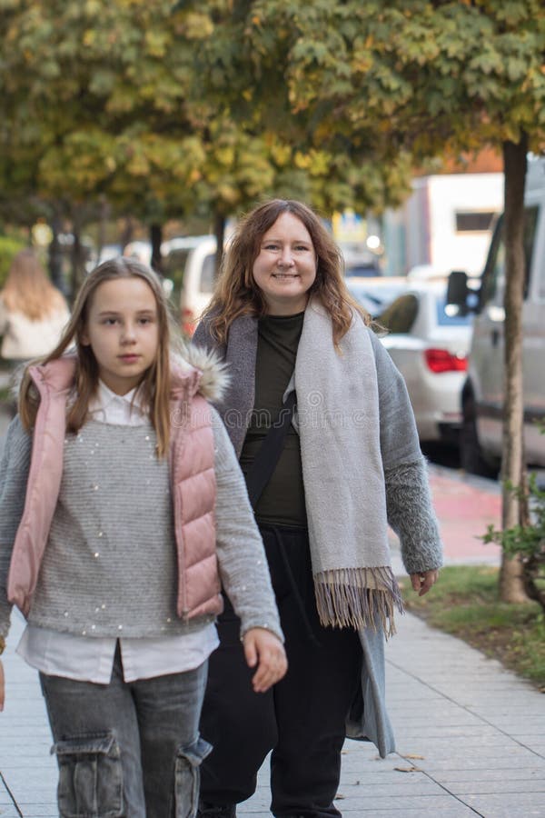Outdoors Portrait of Daughter and Mother Walking Stock Photo - Image of ...