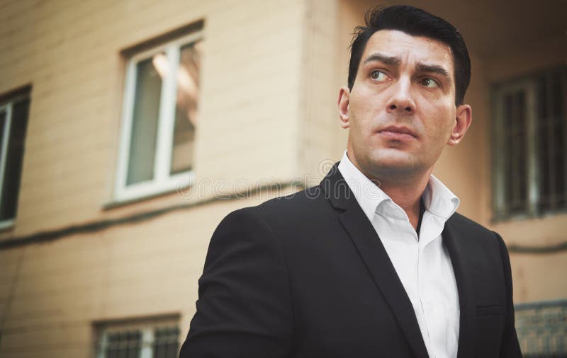 Outdoors Portrait of a Man in Black Suit Looking Up Stock Photo - Image ...