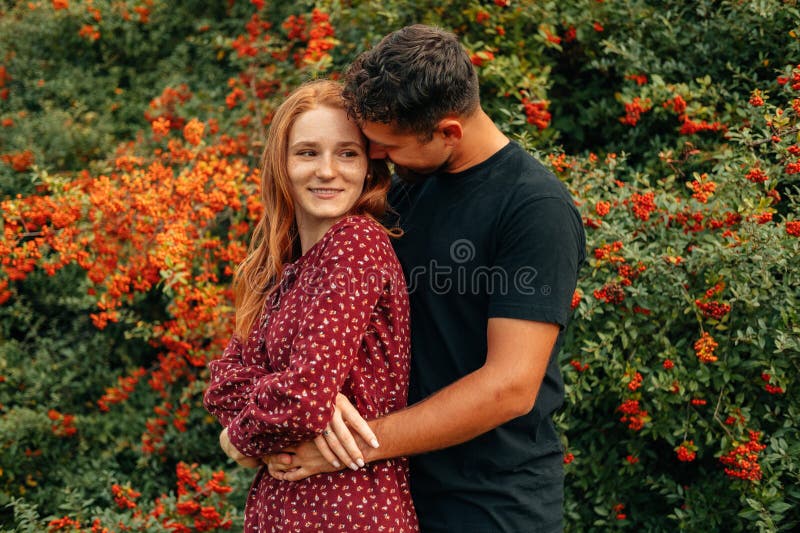 Outdoors Shot Of An In Love Husband Embracing His Beautiful Happy Wife