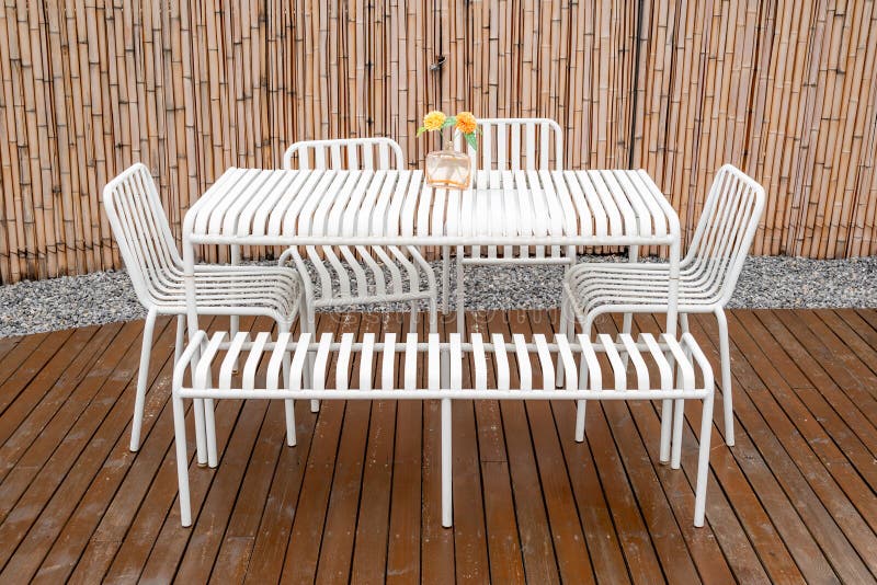 Outdoors White Steel Table and Chairs on a Wooden Terrace Stock Photo ...