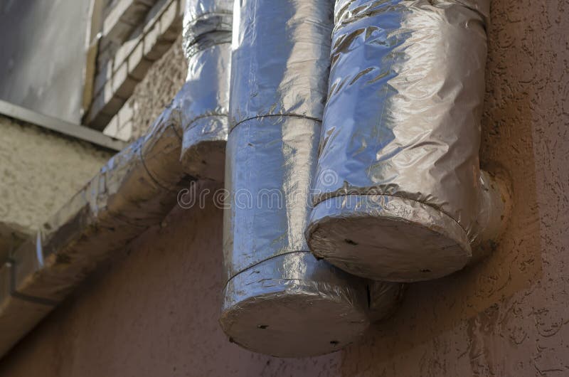 The Outer Wall of the Building with Insulated Pipes Stock Image - Image ...