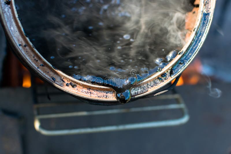 Outflow of Melted Hot Black Tar with Steam for Oil Refining Stock Photo ...
