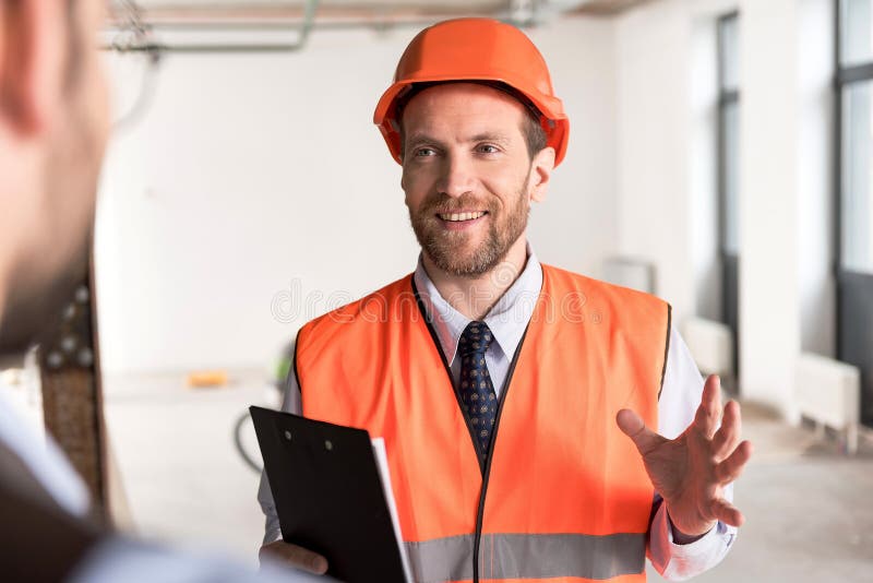 Outgoing Constructor Speaking with Colleague in Room Stock Image ...