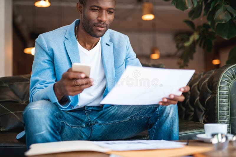 Outgoing Male Reading Document and Using Gadget Stock Image - Image of ...