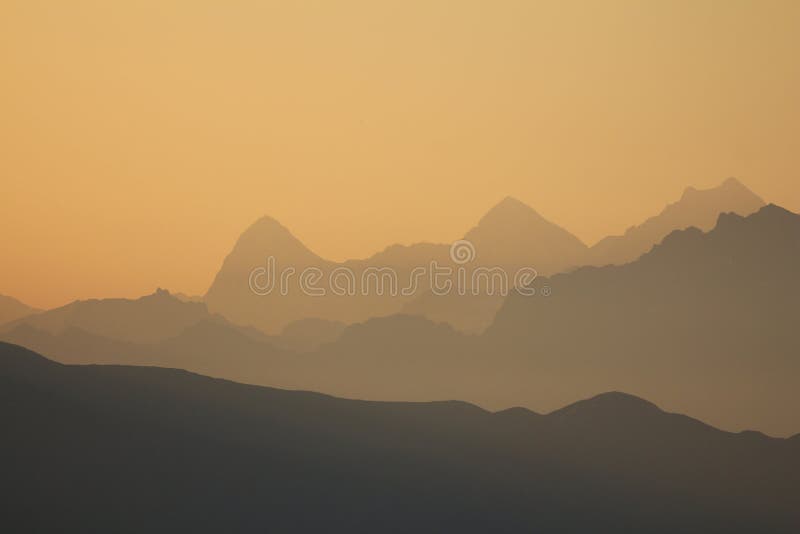 Outlines of Mountain Ranges in the Golden Morning Hour Stock Image ...