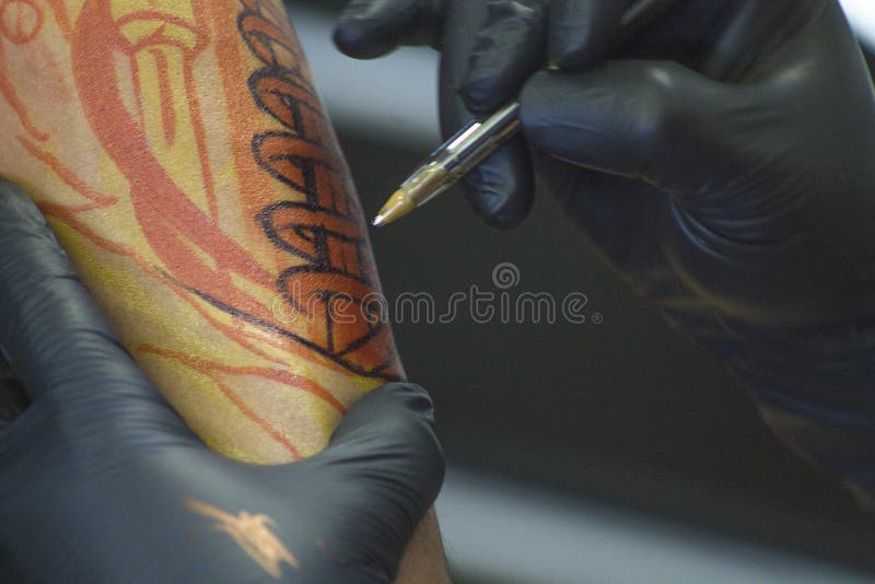 Outlining the tattoo stock image. Image of design, tattoo - 125700805