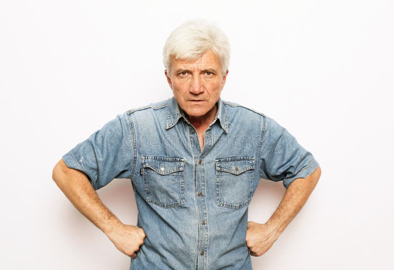 Outraged Elderly Man Looking Furiously at Camera with Hands on Hips ...
